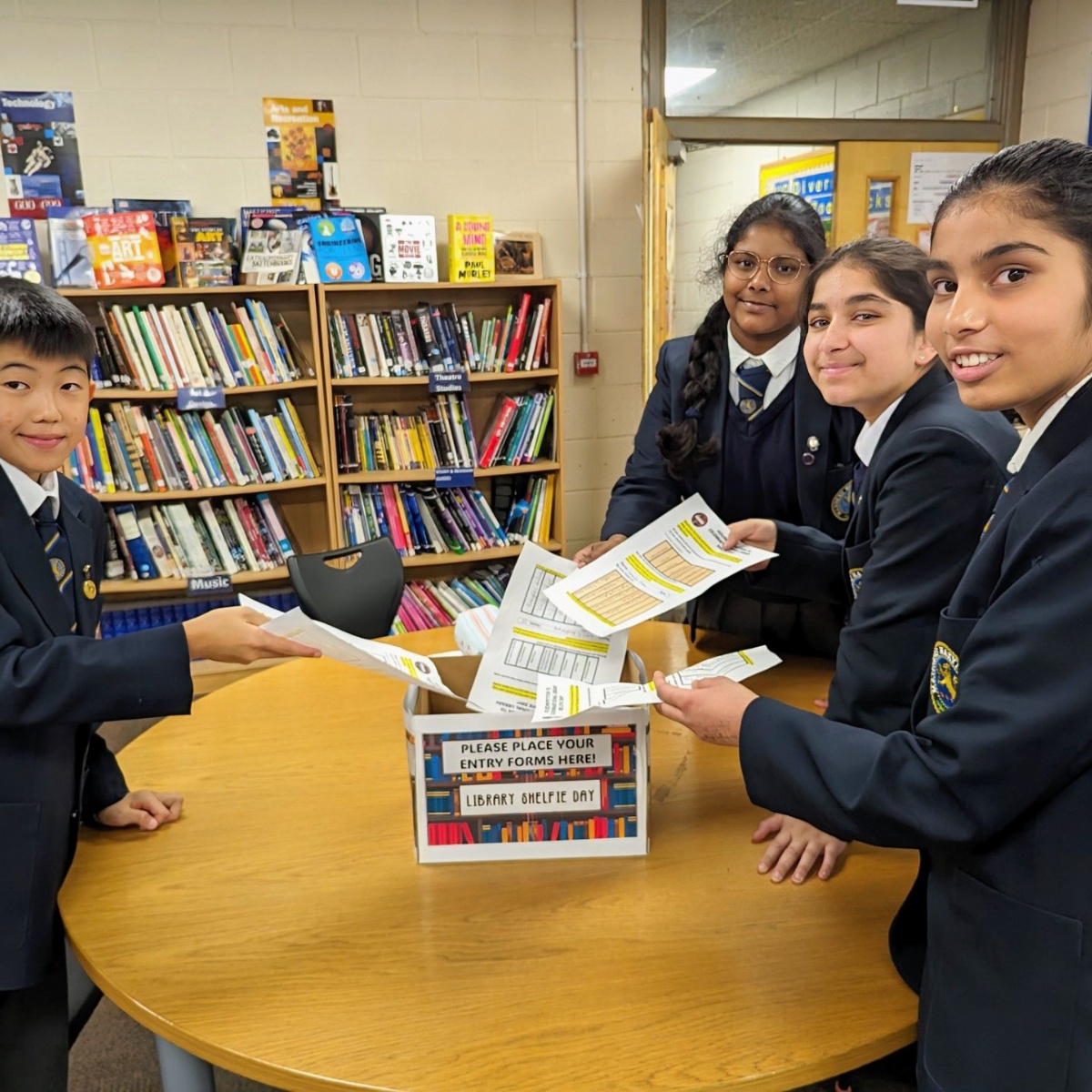 Urmston Grammar School - house competition for library shelf-ie day